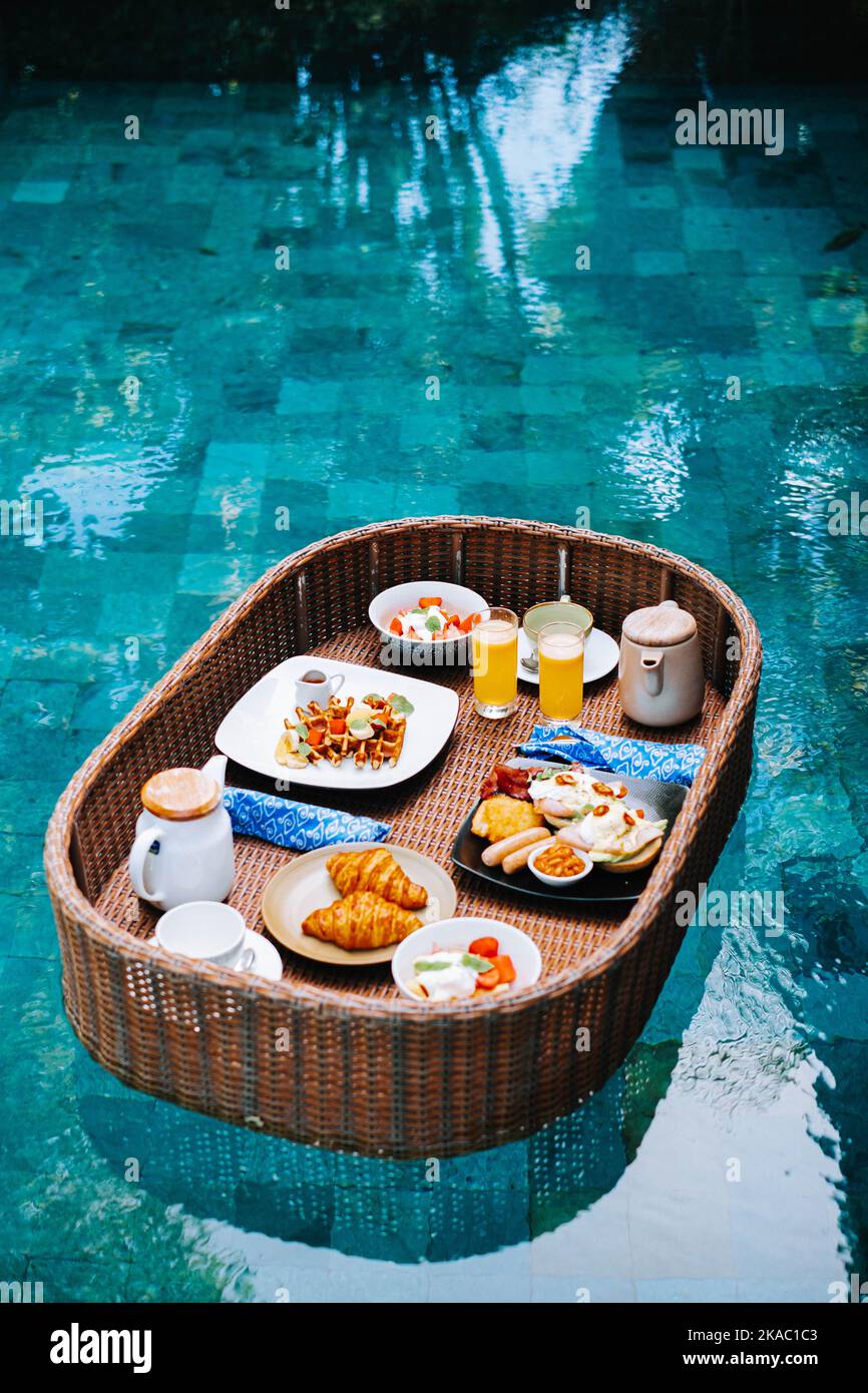 Breakfast tray that made from bamboo is floating in the middle of ...