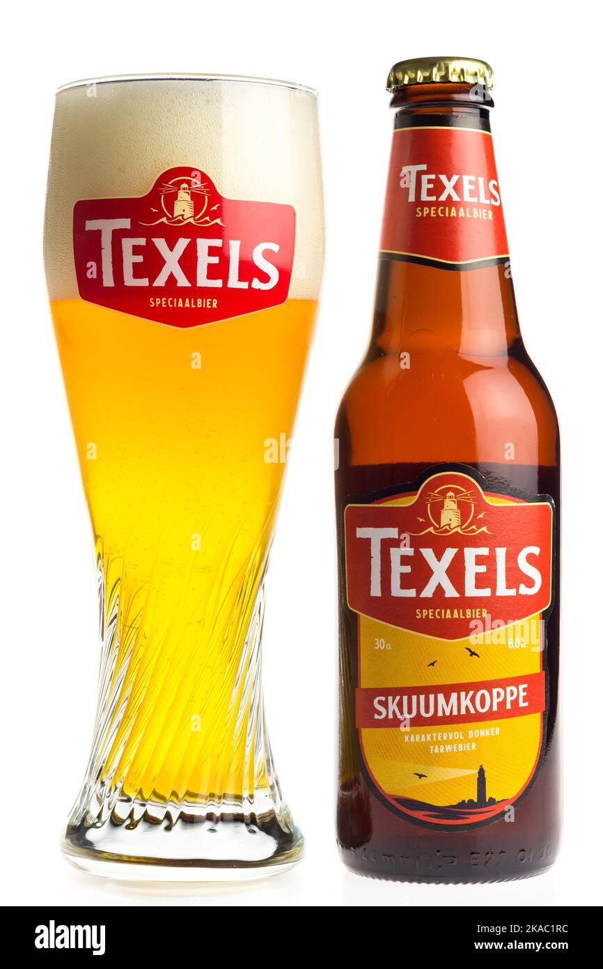 Bottle and glass of Dutch Texels Skuumkoppe craft beer isolated on a ...