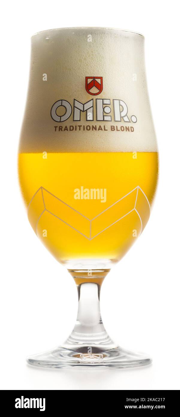 Glass of Omer Traditional Blond beer isolated on a white background ...