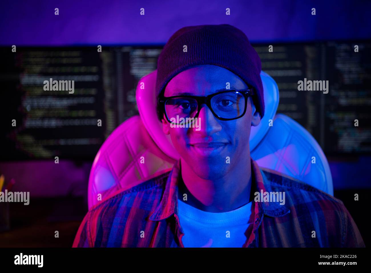 Portrait of positive smart handsome guy sitting chair operating ...