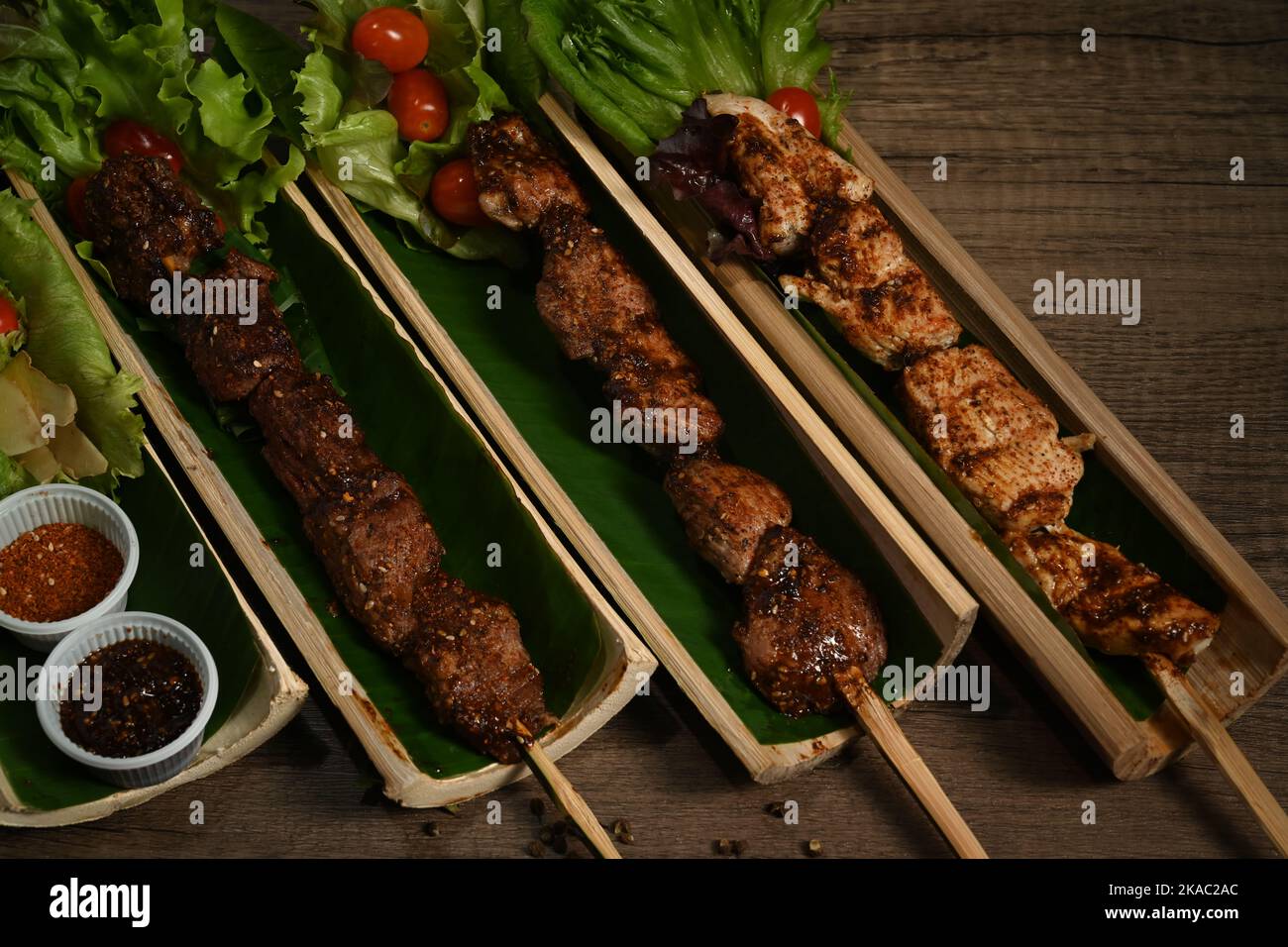 Delicious grilled meat served in bamboo barrel plat. Mala Chinese BBQ ...