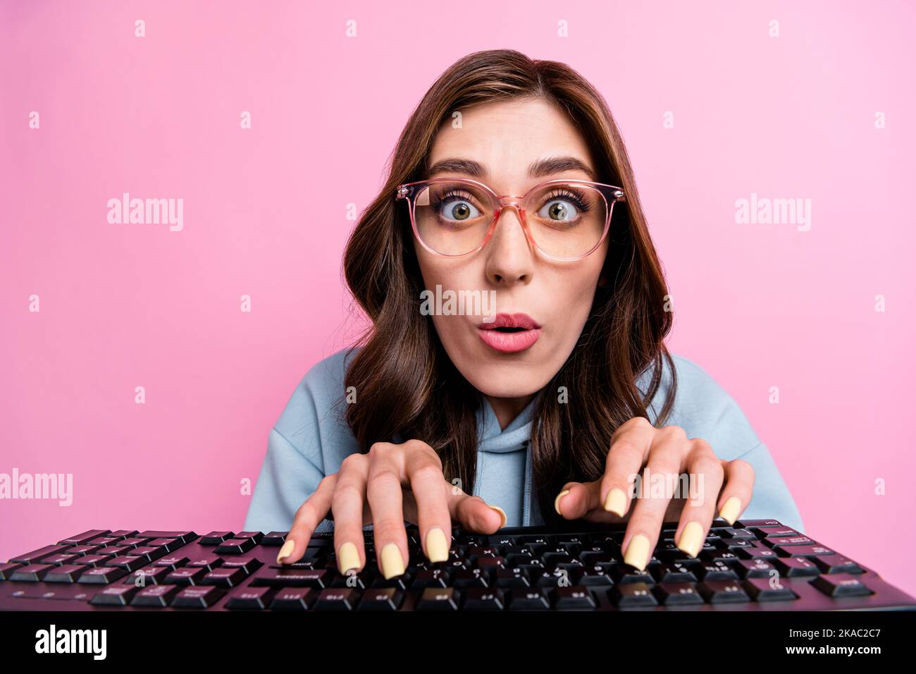 Photo of impressed confused person pouted lips stare keyboard typing ...