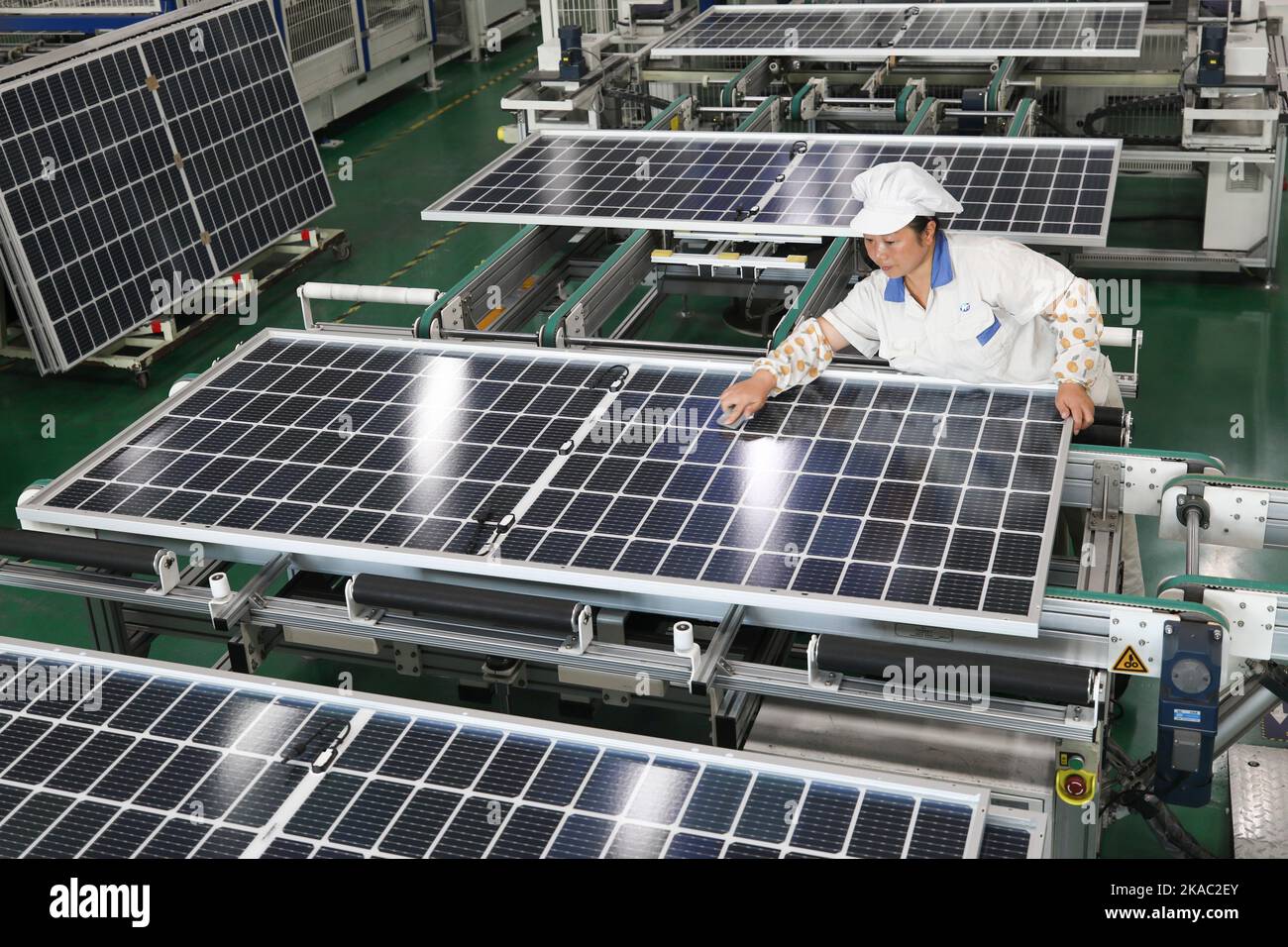 Workers are busy manufacturing the export solar photovoltaic panels in ...
