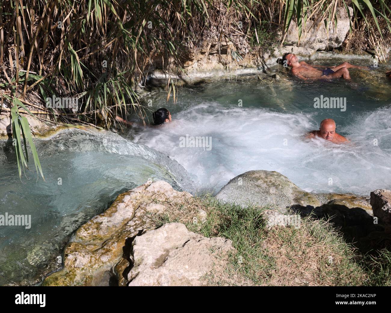 Saturnia, Italy - September 13, 2022: People are bathing in the hot ...