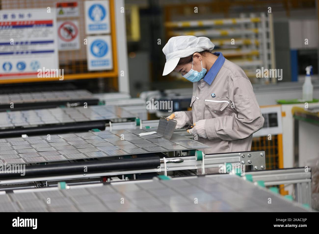 Workers are busy manufacturing the export solar photovoltaic panels in ...
