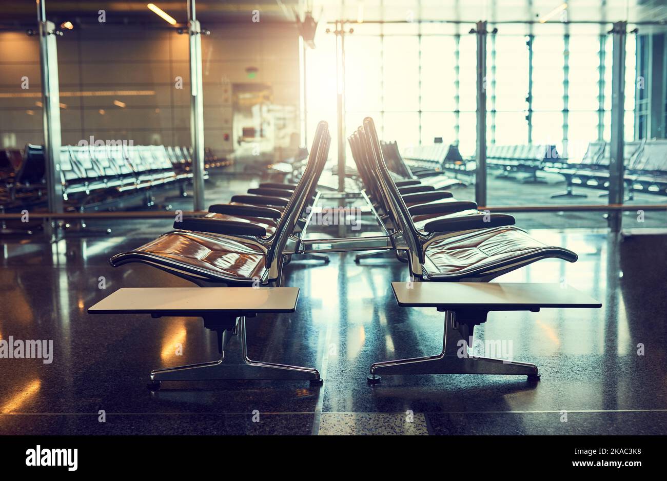 Arrivals and departures. rows of seats in an empty airport departure ...