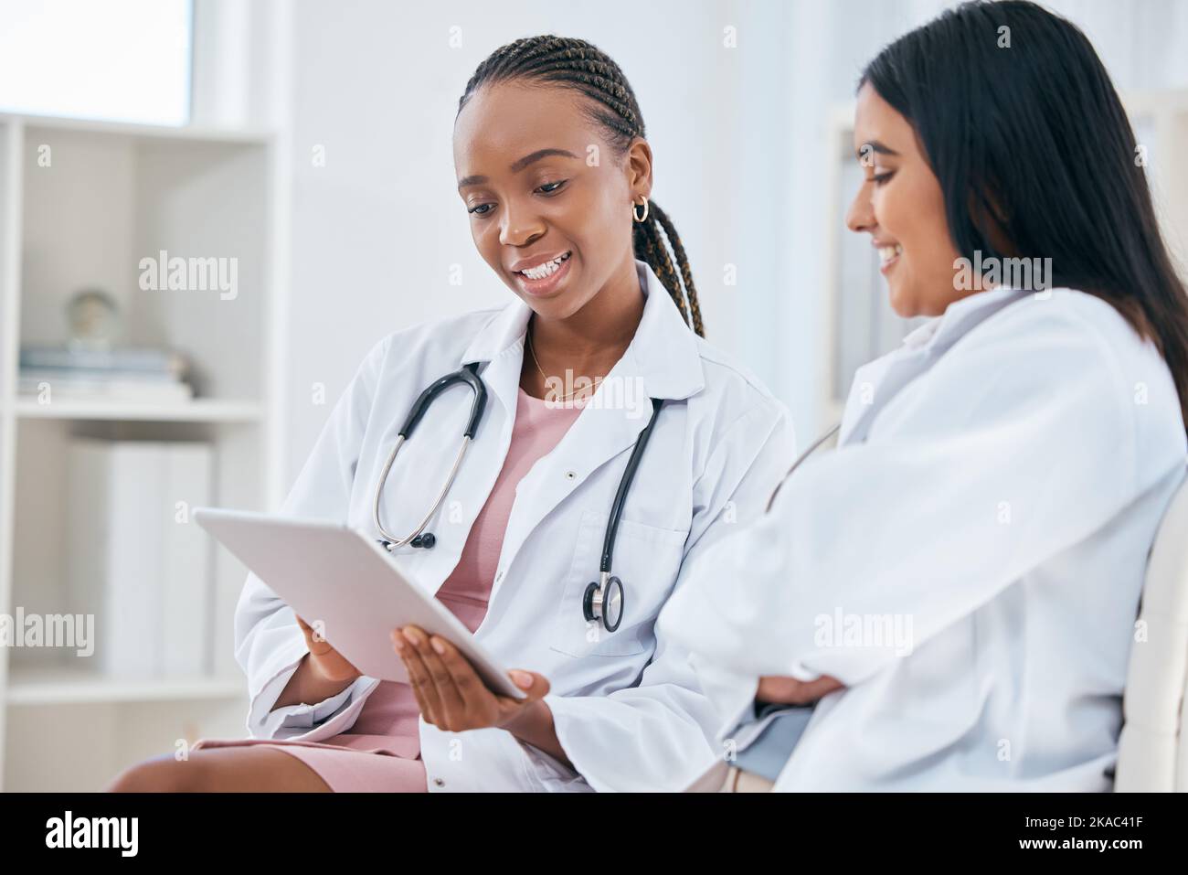 Doctor, women and digital tablet in a hospital for healthcare, planning ...
