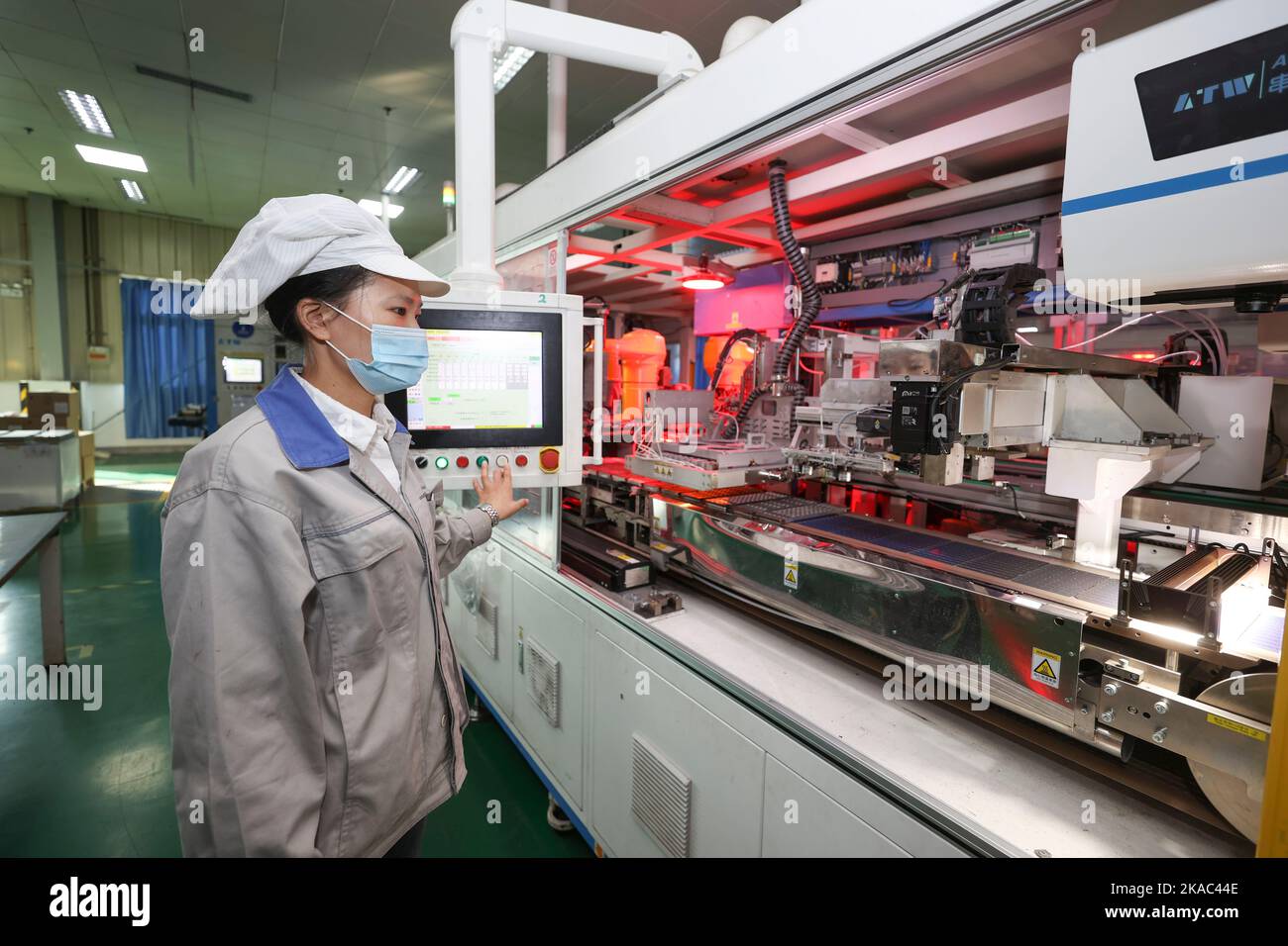 Workers are busy manufacturing the export solar photovoltaic panels in ...