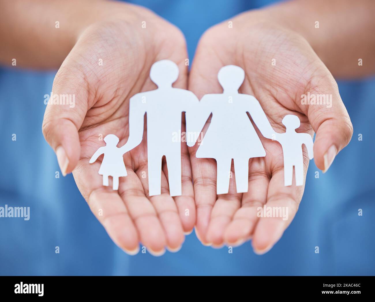 Cutout paper family, woman hands for security and safety together for ...