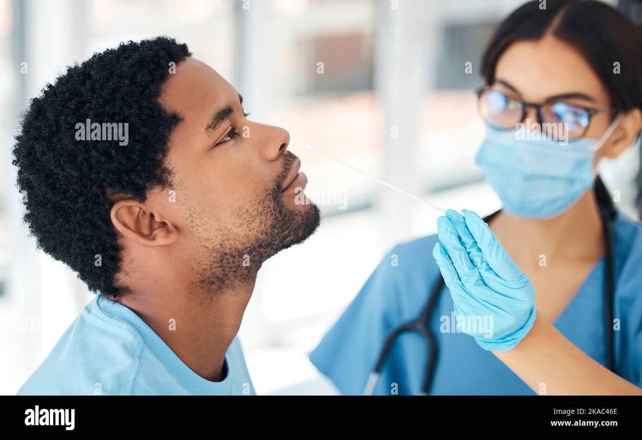 Healthcare, hand and covid test by doctor with man in hospital for ...