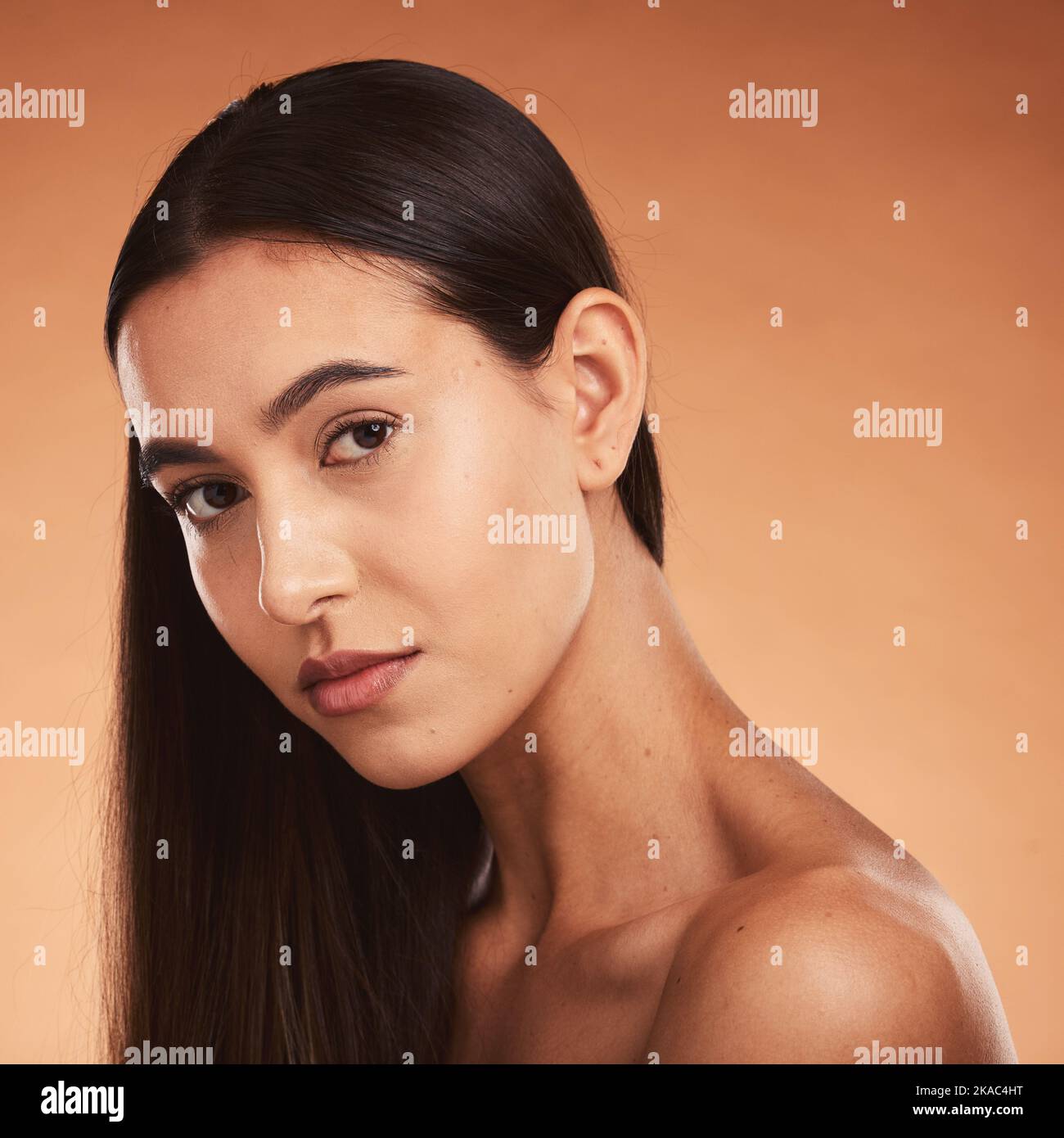 Face portrait, hair care and skincare of woman on brown studio background. Makeup cosmetics ...