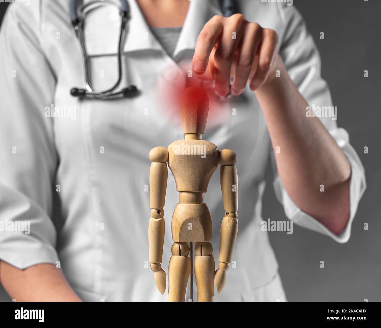 Headache concept. Red pain of head ache on wood dummy Stock Photo - Alamy