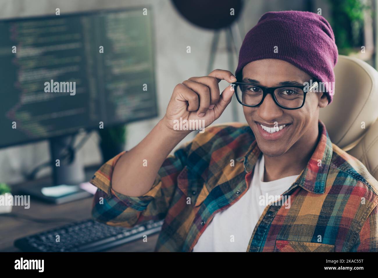 Portrait of cheerful clever hacker guy hand touch eyeglasses toothy ...