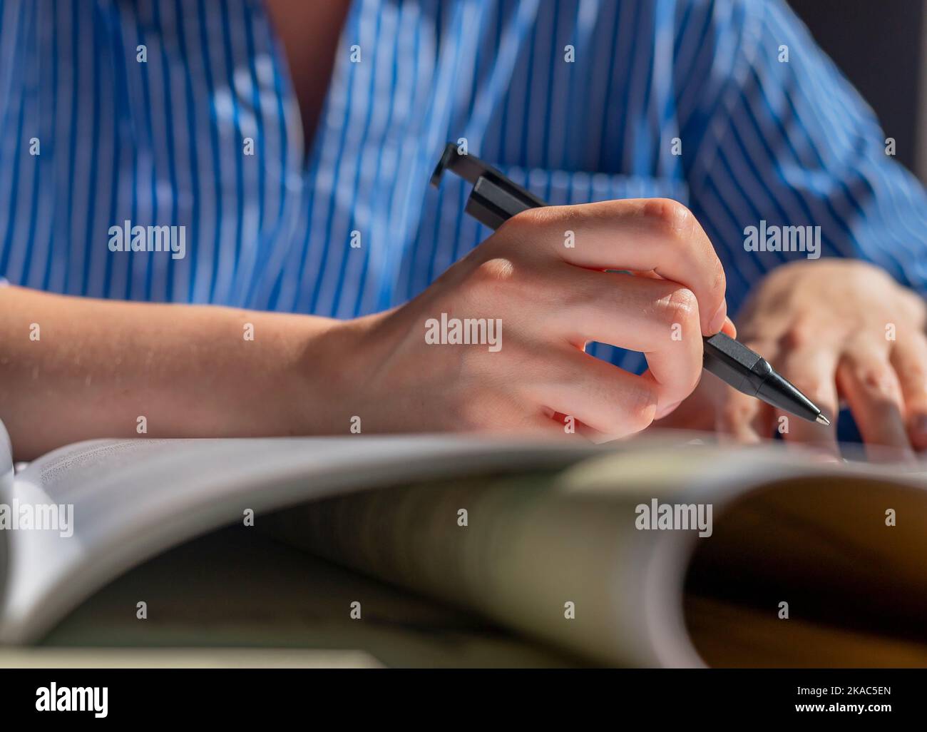 Female hands closeup with pen taking notes, writing in notebook Stock ...