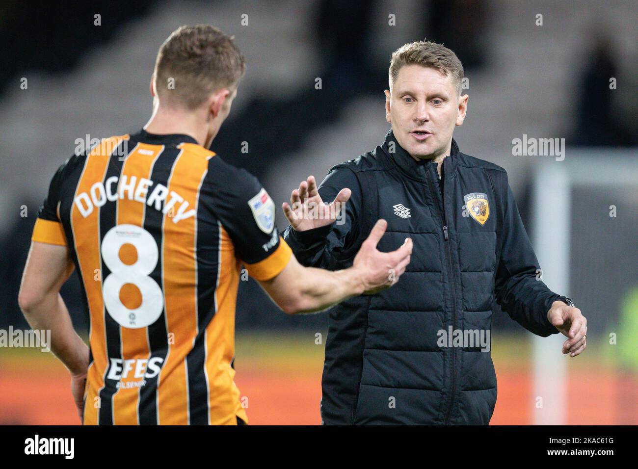 First team coach Andy Dawson shakes hands with Greg Docherty #8 of Hull ...