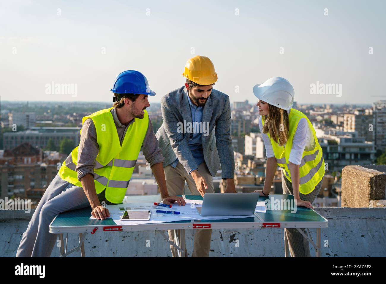 Business, teamwork and people concept. Group of engineers and ...