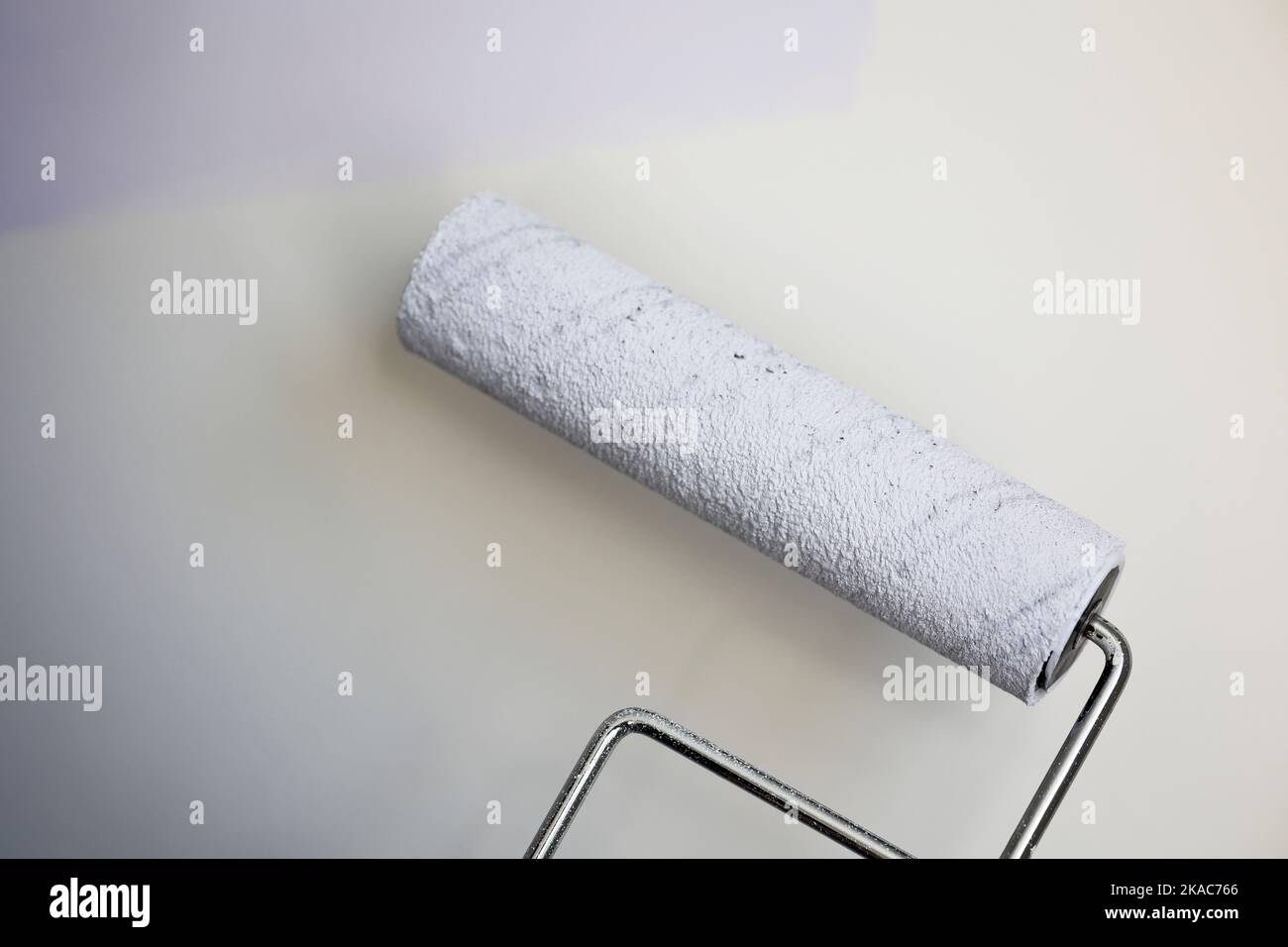 Paint roller loaded with white paint ready to use on the wall Stock ...