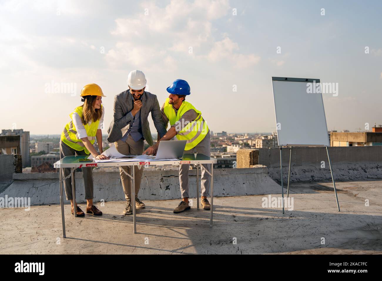 Construction concept. Engineers and architects working at construction ...