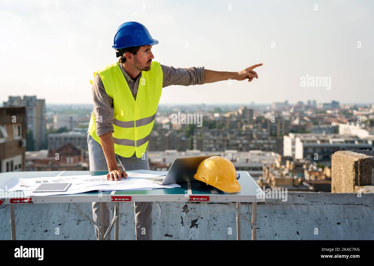 Young businessman construction site engineer working with architect ...