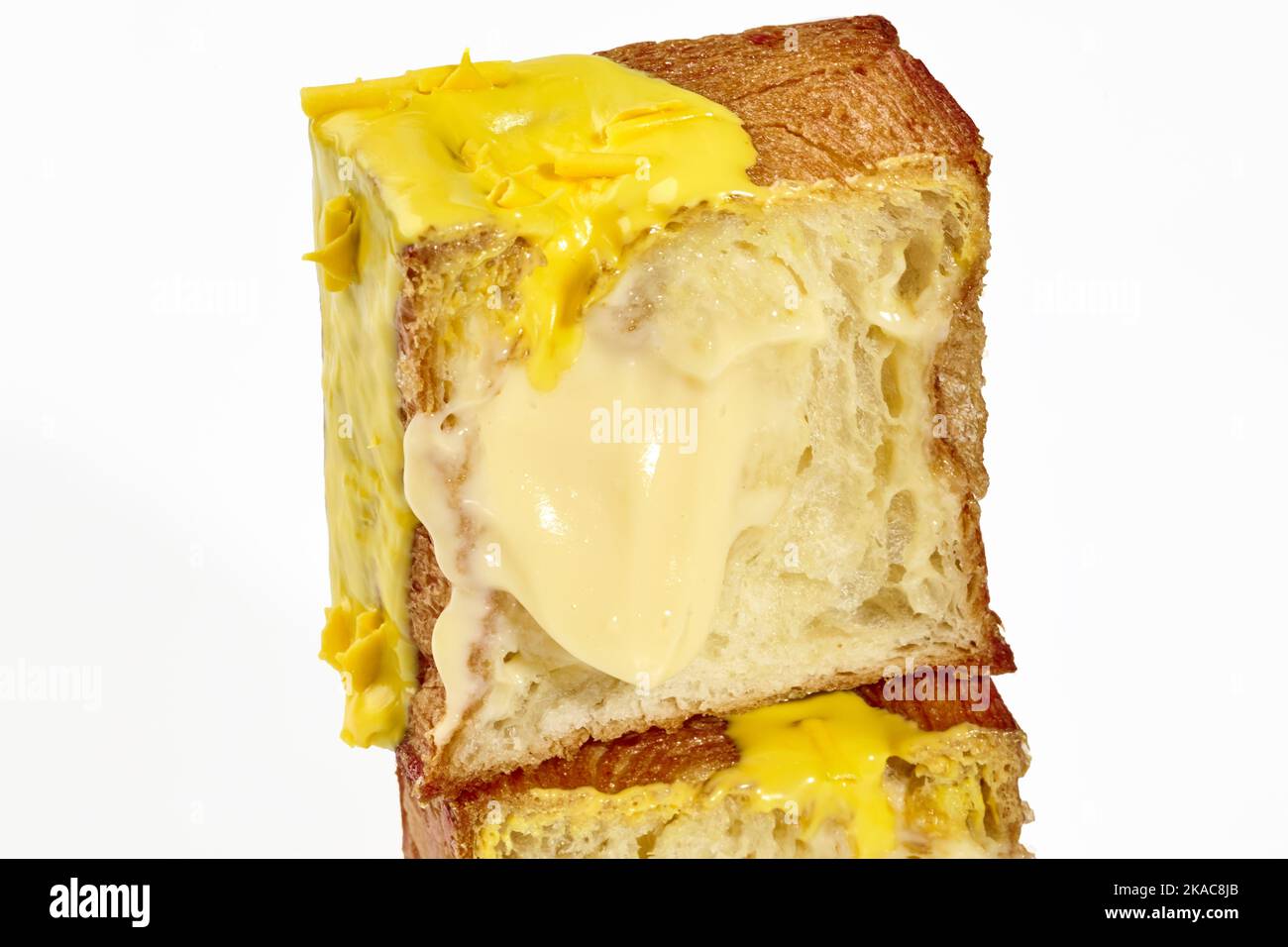 Closeup of sliced puff pastry cube shaped croissant with vanilla ...