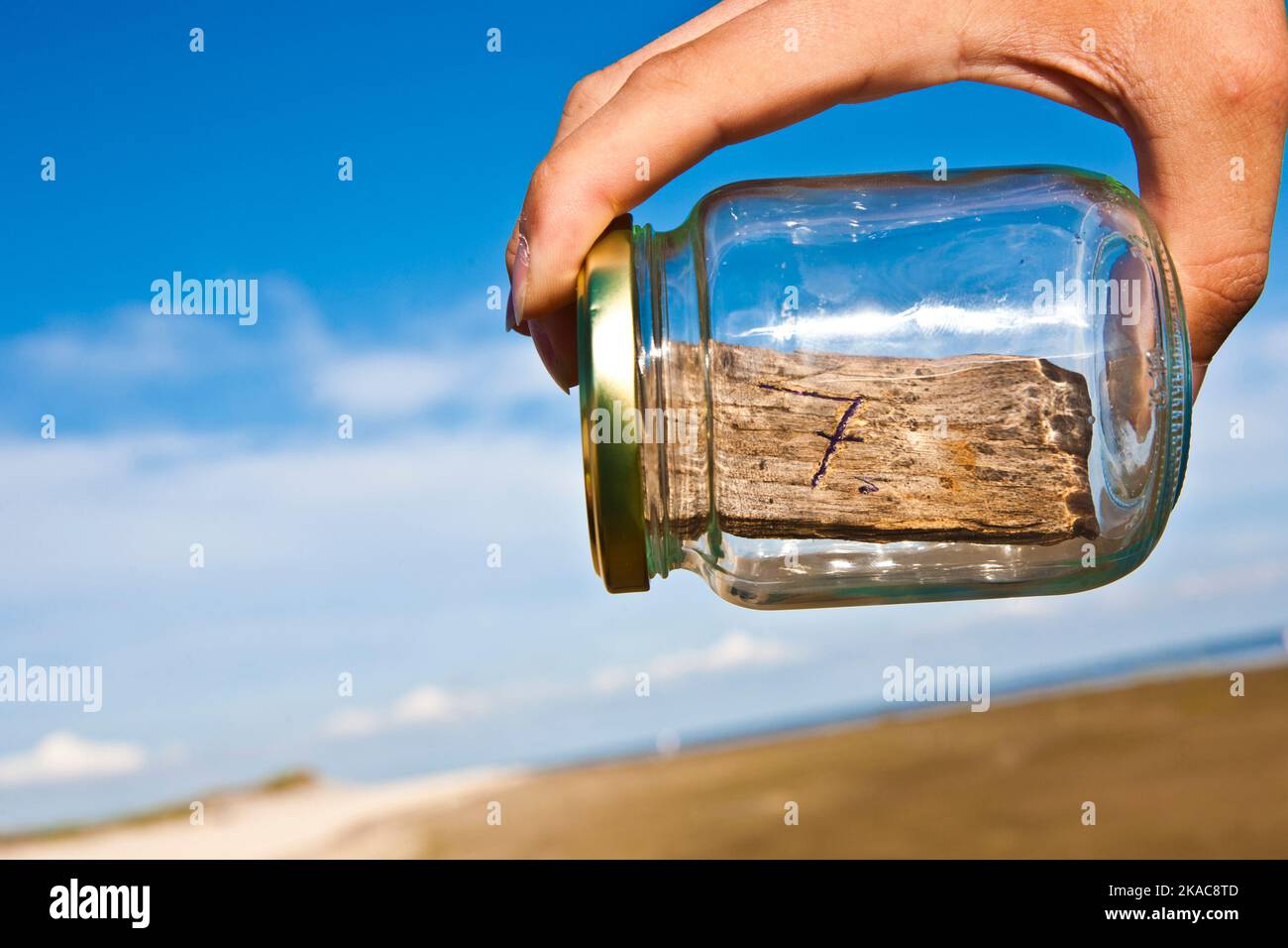 peace of wood with an engraved number with blue sky Stock Photo - Alamy
