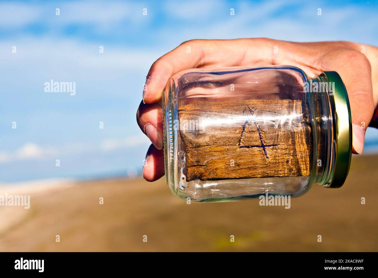 peace of wood with an engraved number with blue sky Stock Photo - Alamy