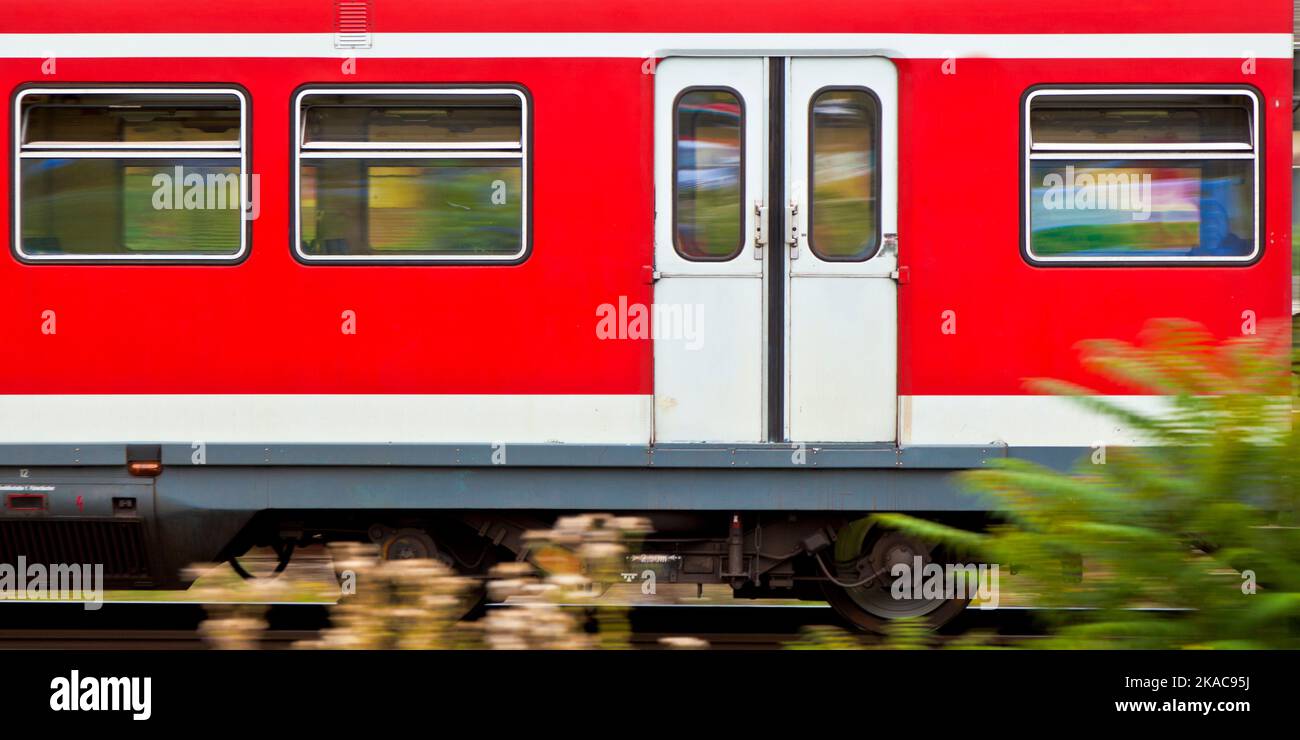 red wagon in motion of a public train Stock Photo - Alamy