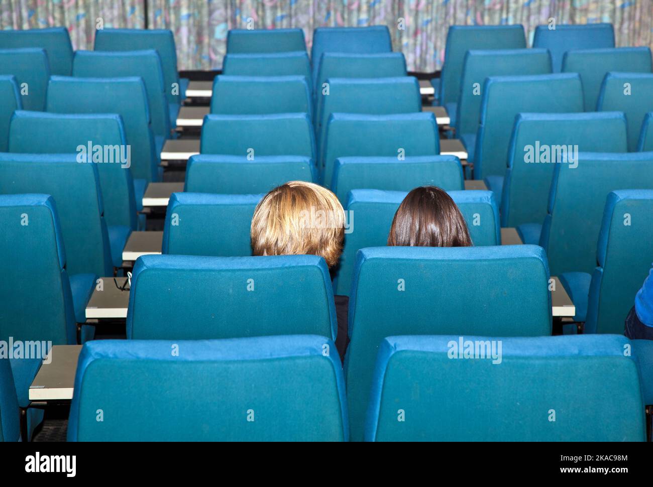 teenager sitting in a cinema waiting for the film Stock Photo - Alamy