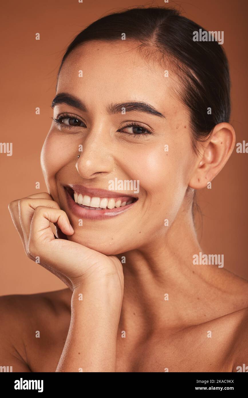 Portrait, beauty and skincare with a model woman posing in studio on a ...