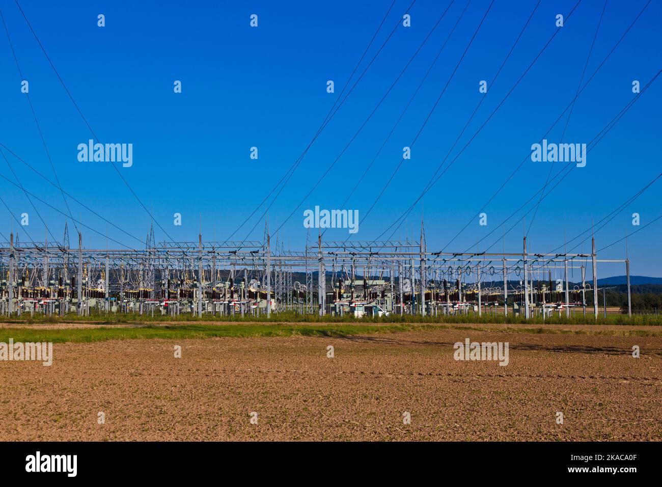 electrical power plant in beautiful colorful meadow Stock Photo - Alamy