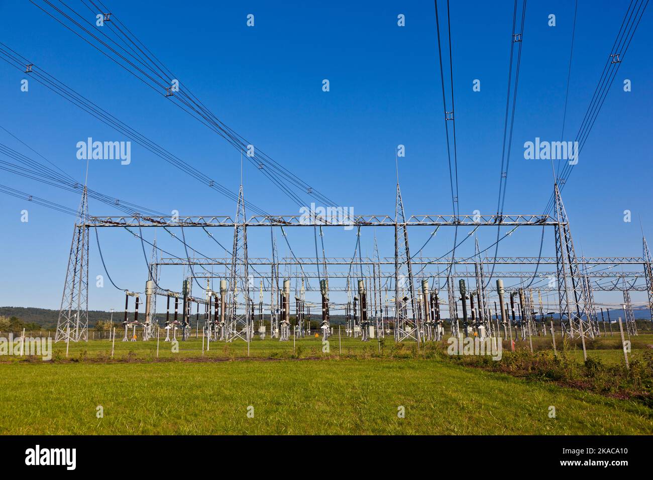 electrical power plant in beautiful colorful meadow Stock Photo - Alamy