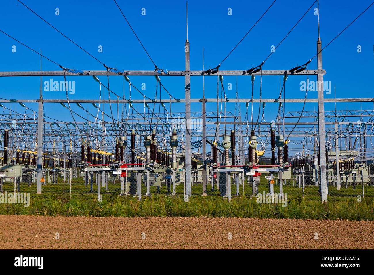 electrical power plant in beautiful colorful meadow Stock Photo - Alamy