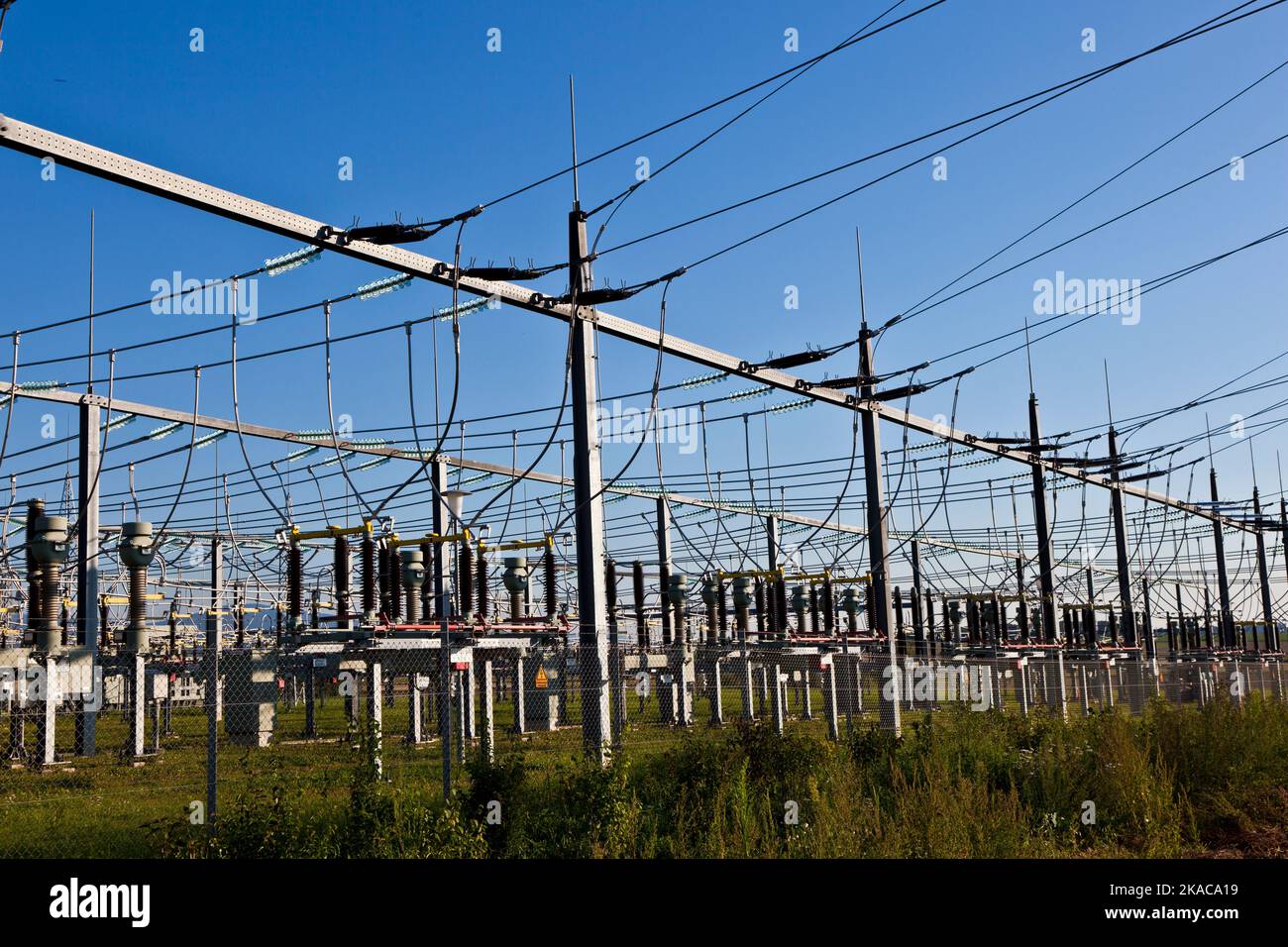 electrical power plant in beautiful colorful meadow Stock Photo - Alamy
