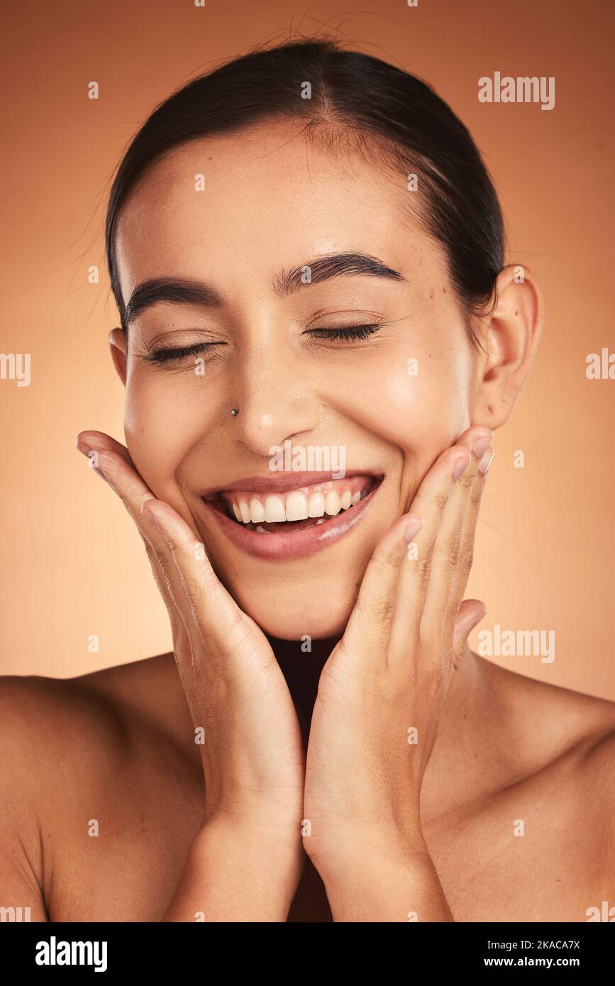 Face, beauty smile and woman with eyes closed on brown studio ...