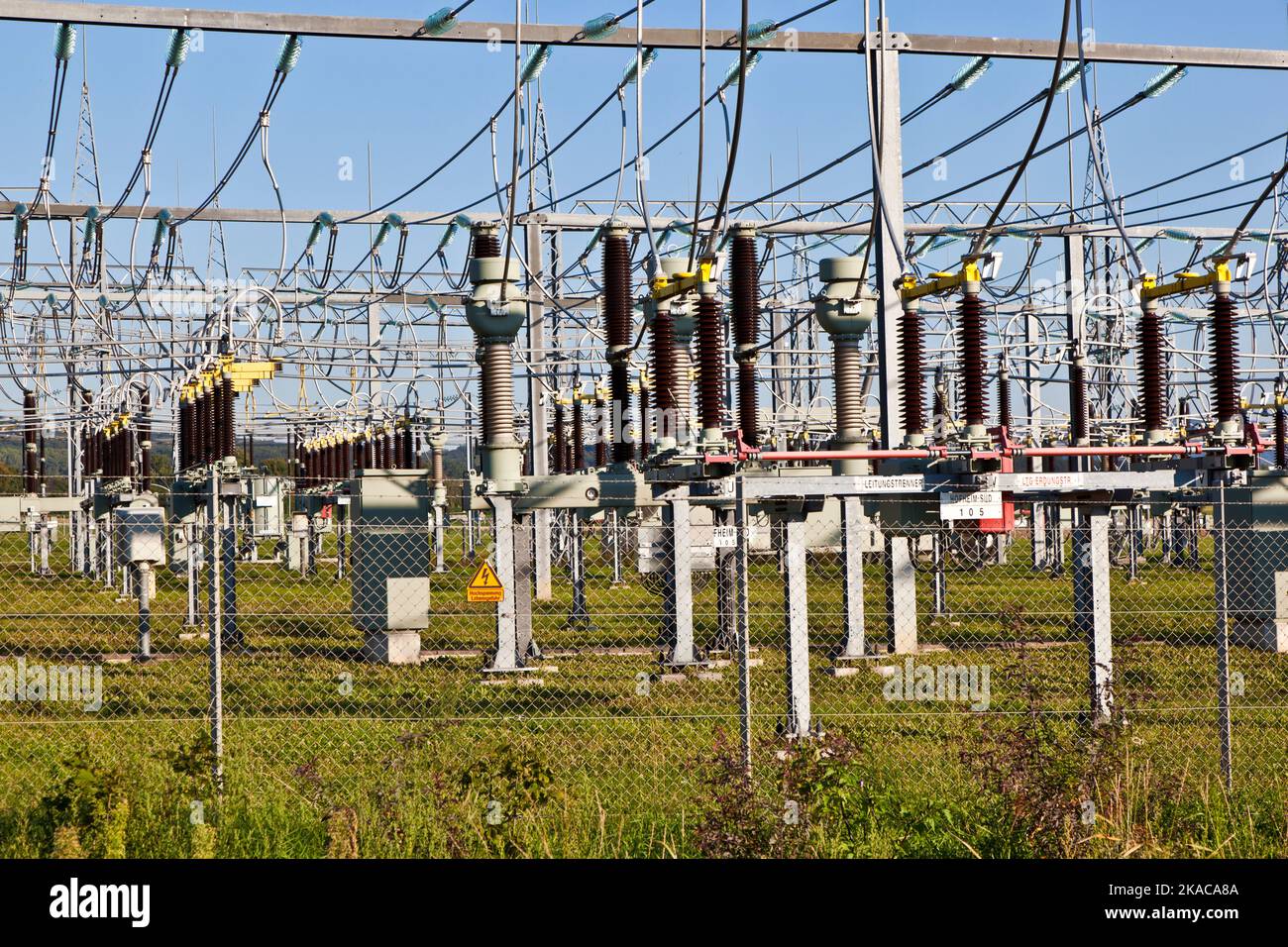 electrical power plant in beautiful colorful meadow Stock Photo - Alamy