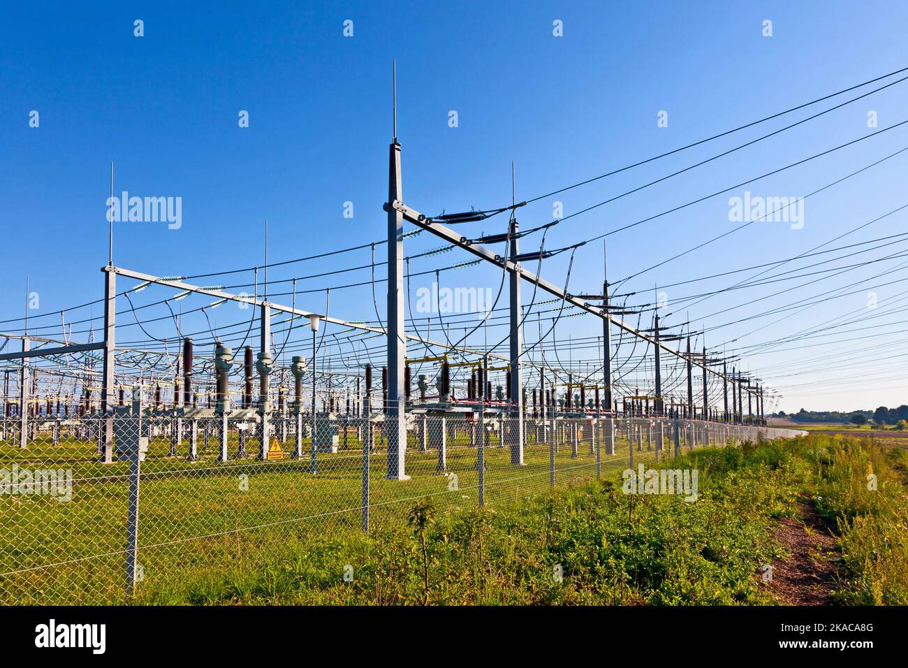 electrical power plant in beautiful colorful meadow Stock Photo - Alamy