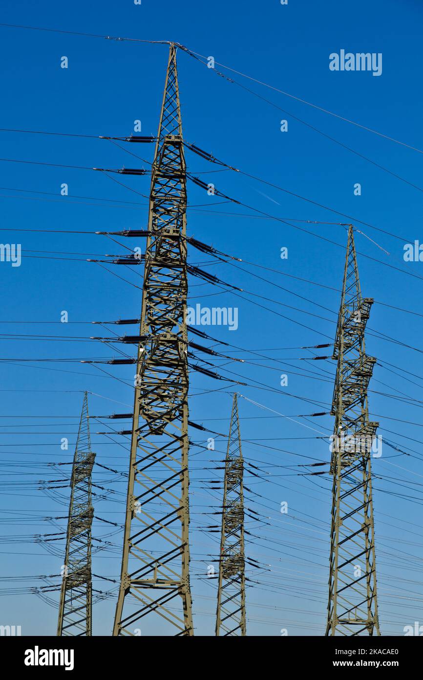 electrical pylon under blue sky, power line cable Stock Photo - Alamy