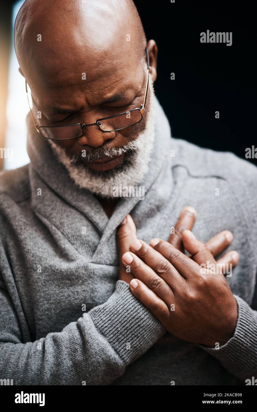 African man holding chest pain hi-res stock photography and images - Alamy