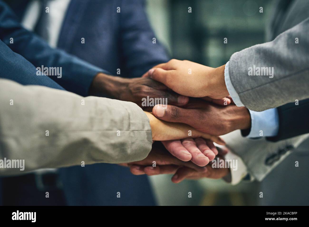 Lets stand together and achieve the impossible. Closeup shot of a group ...