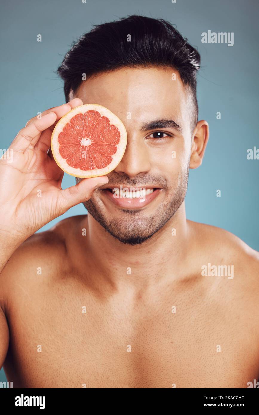Happy studio portrait, grapefruit man for skincare wellness beauty and face smile health against ...