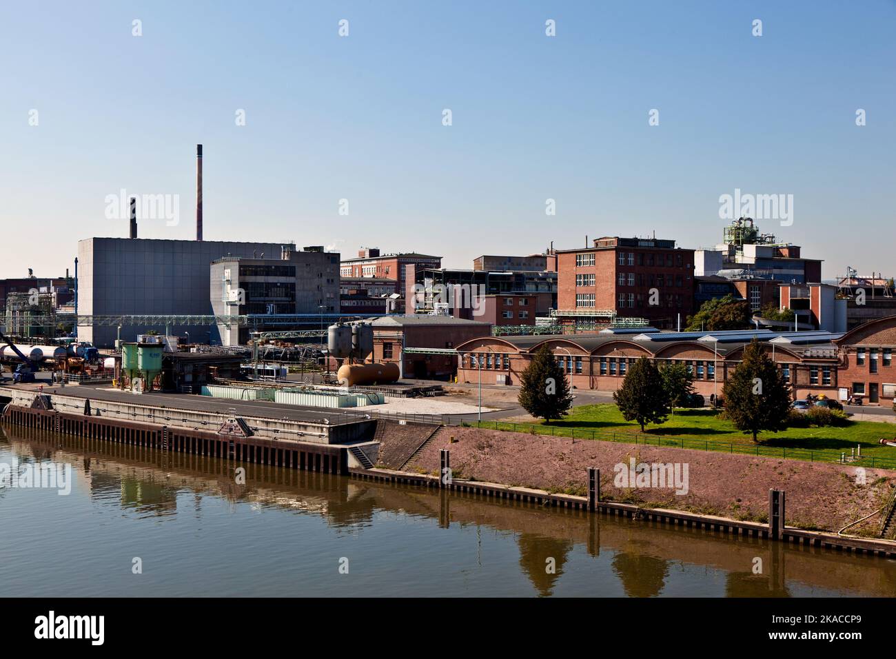 old industrial building at the river Stock Photo - Alamy