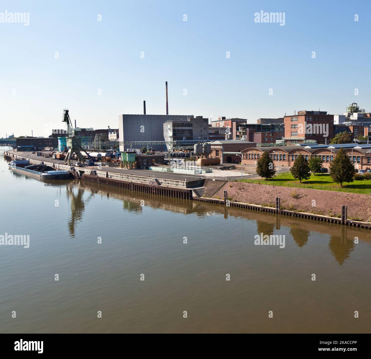 old industrial building at the river Stock Photo - Alamy