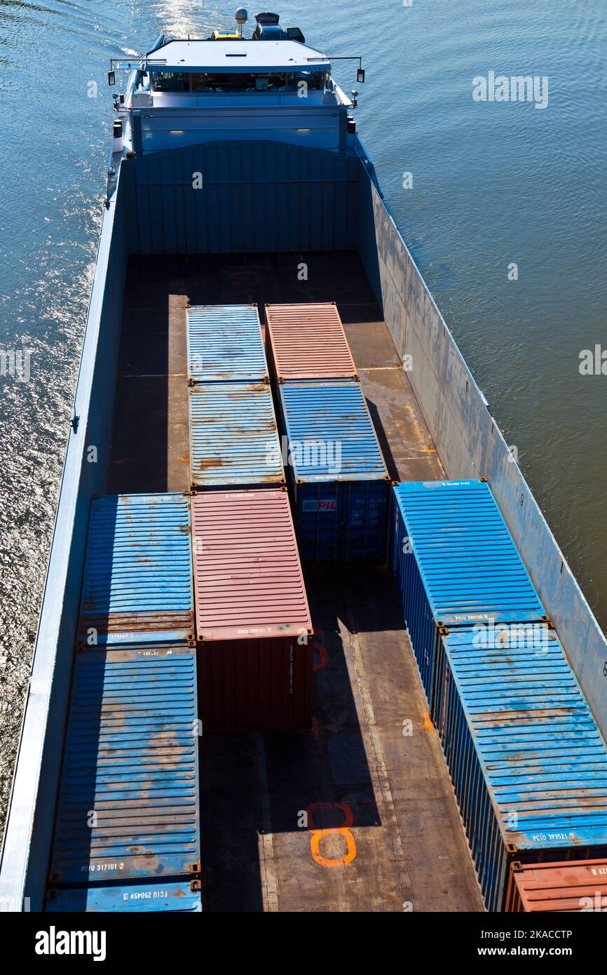 ship on river transports container in belly Stock Photo - Alamy
