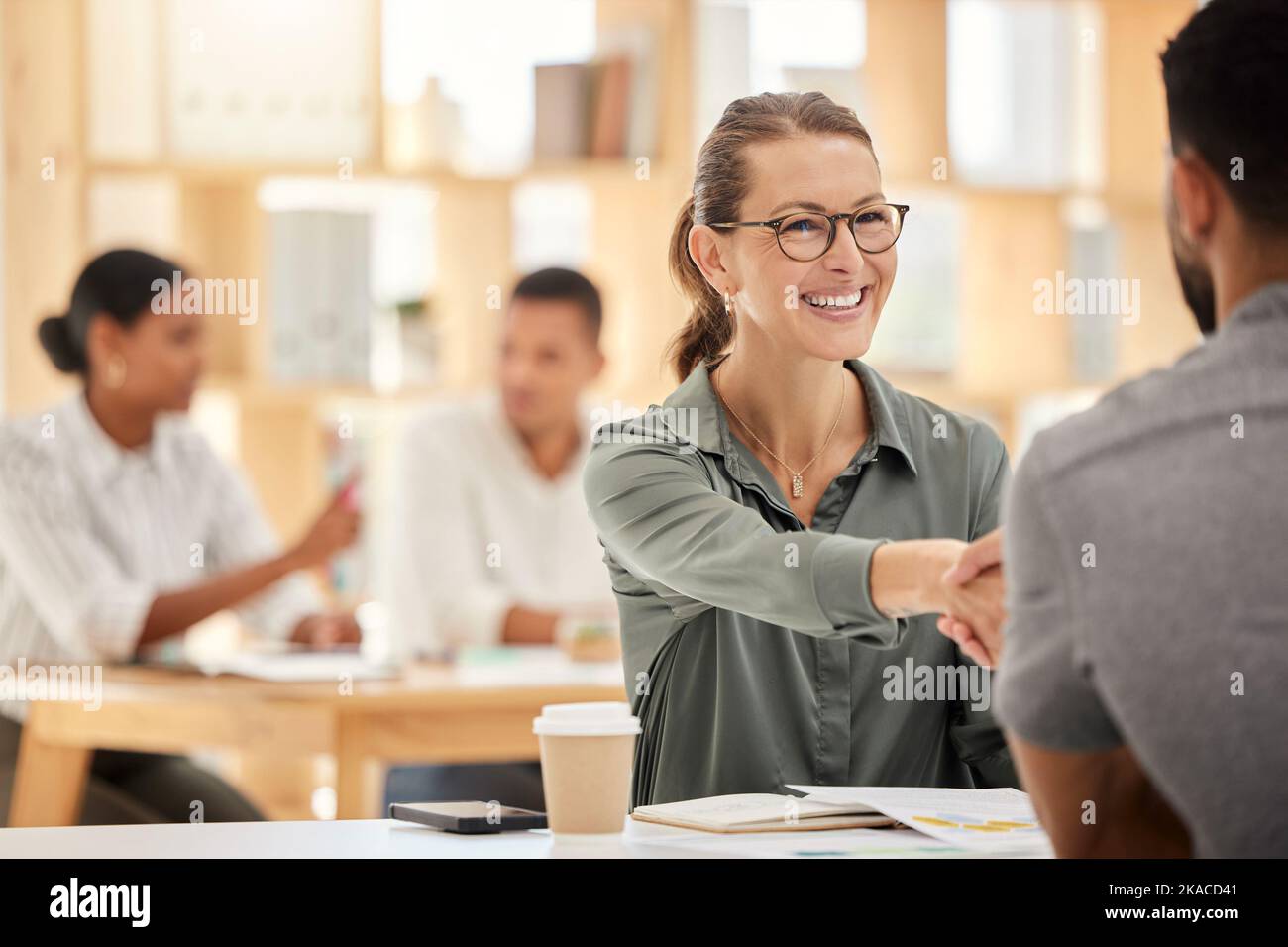Woman handshake hi-res stock photography and images - Alamy