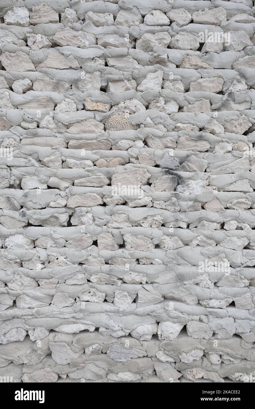 The wall of Rasdhoo resident area, with using some coral and rock as ...