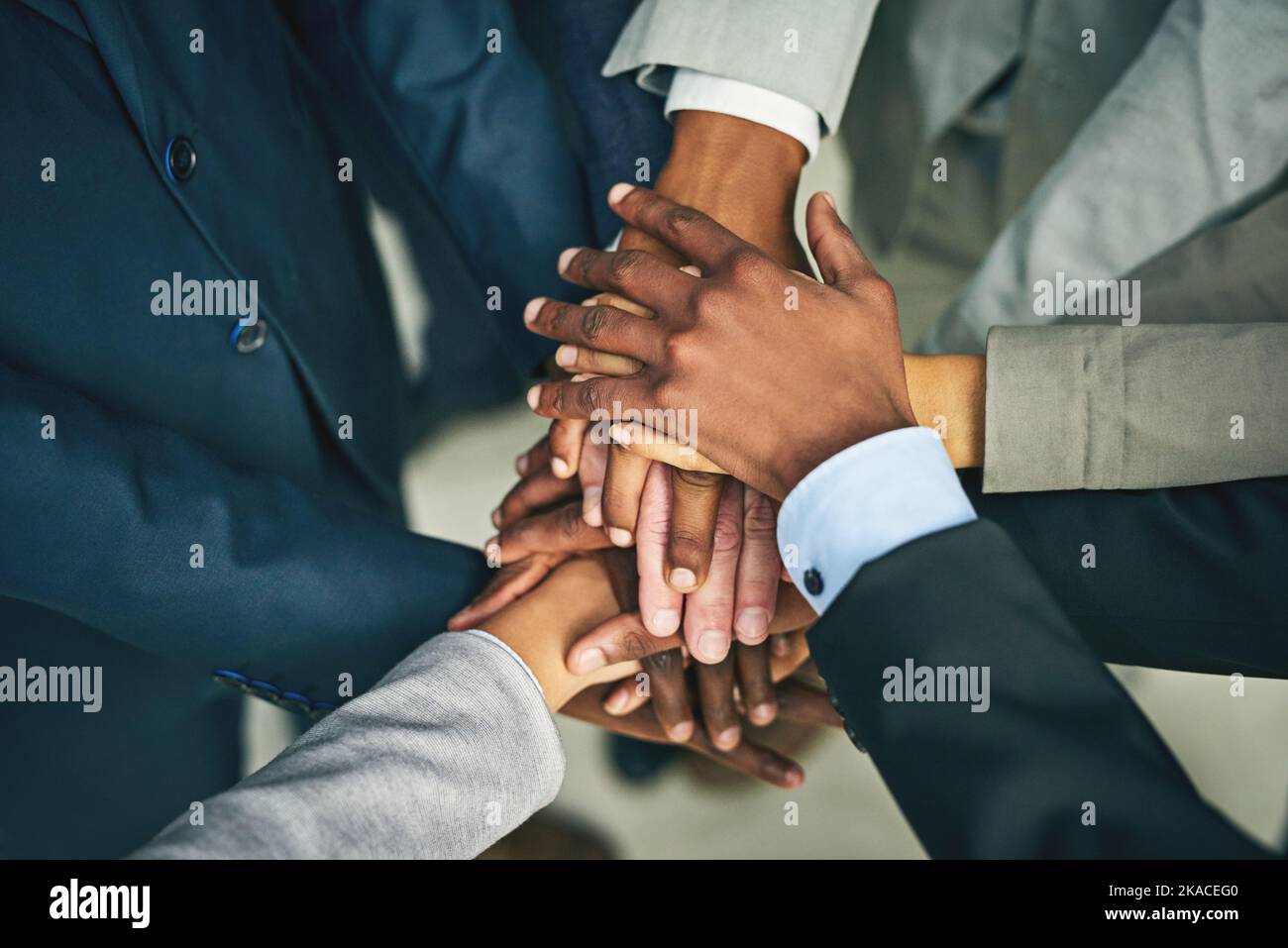 Bring it in, team. Closeup shot of a group of unidentifiable ...