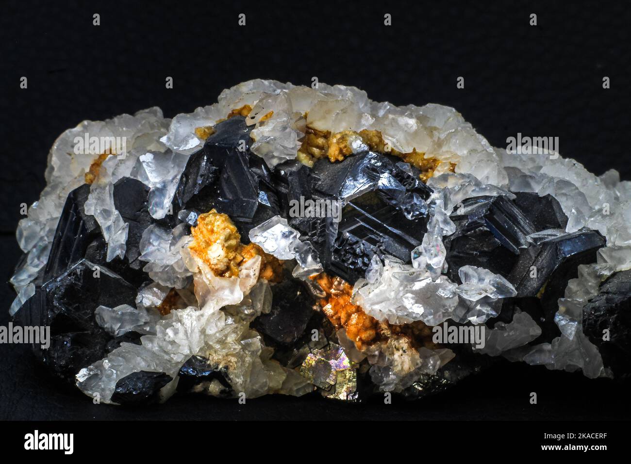 A crystal and stone cluster with clear white quartz, silver metallic ...