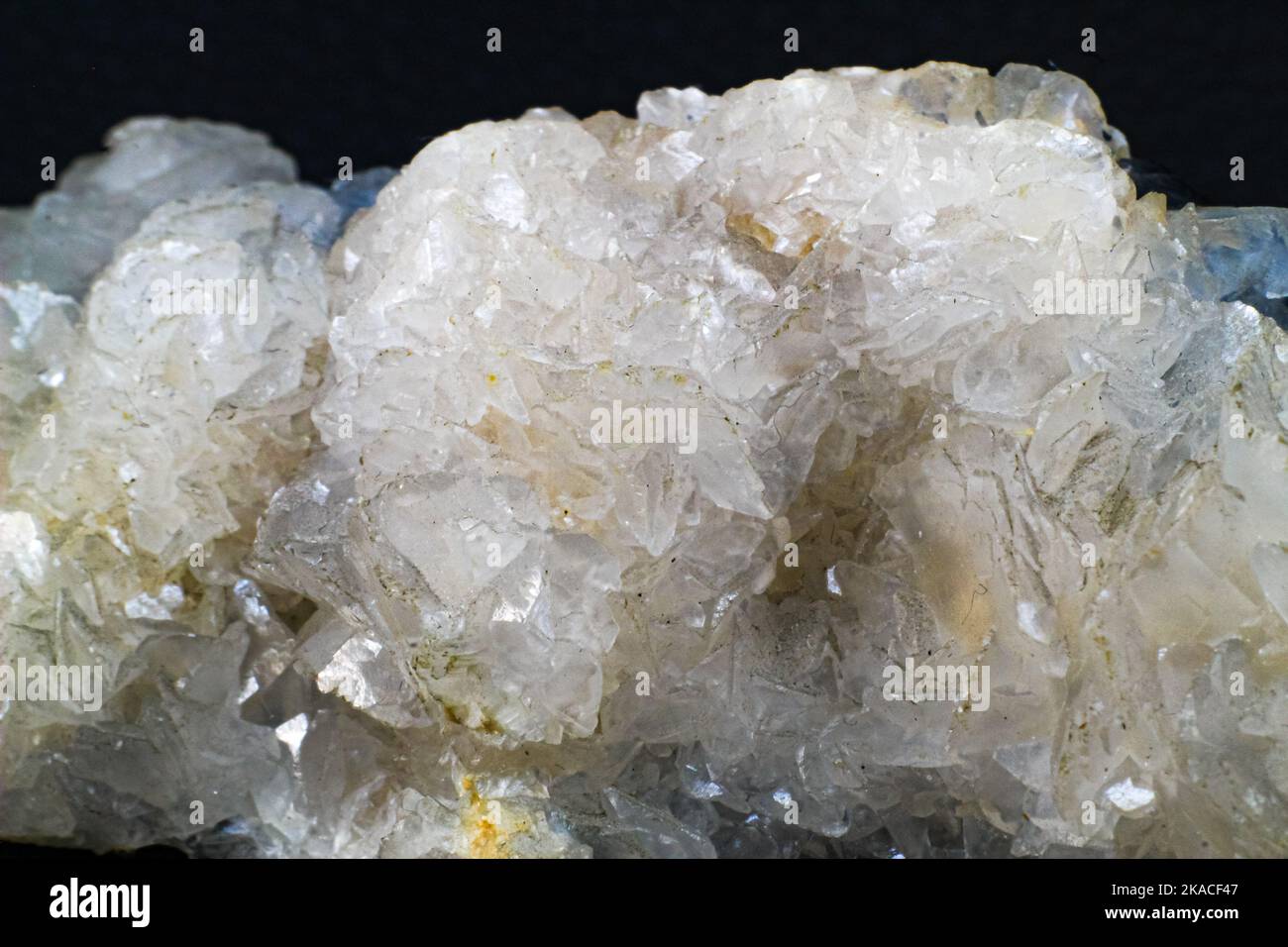 A crystal and stone cluster with clear white quartz, silver metallic ...