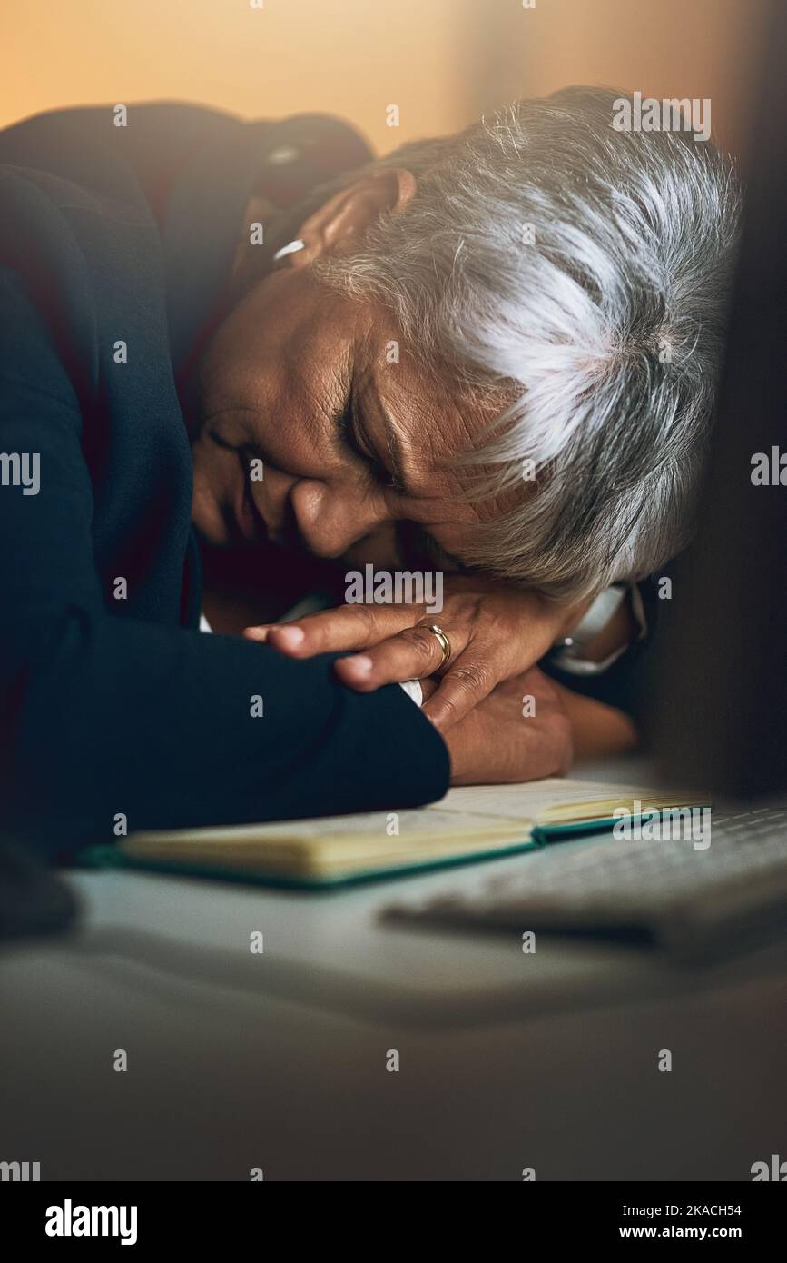 Some days will be a fail. a mature businesswoman sleeping at her desk ...