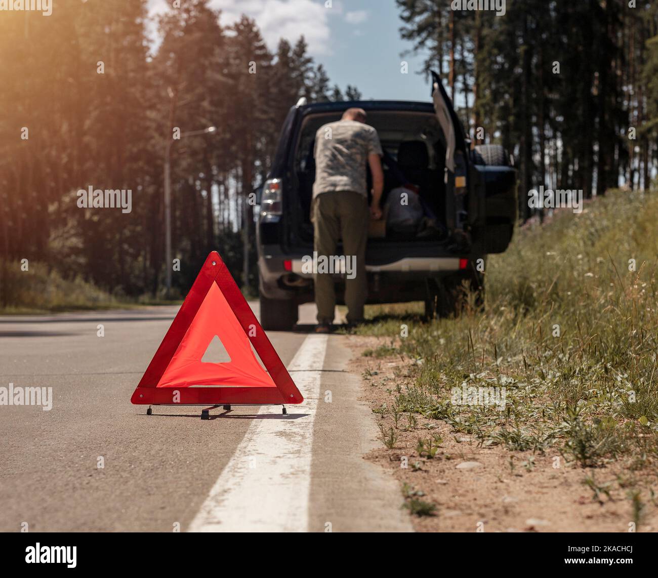 Car standing near stop sign hi-res stock photography and images - Alamy